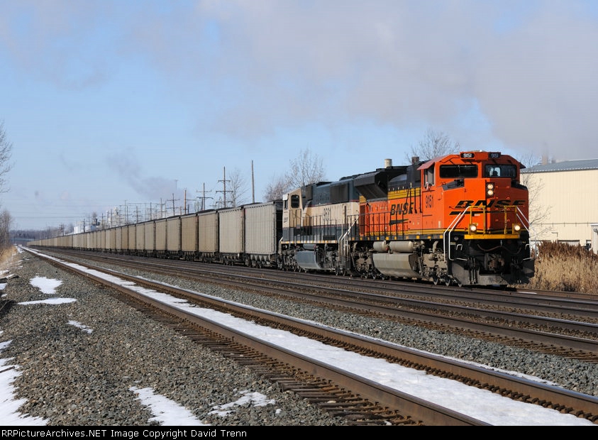 BNSF 9151 and 9621 lead Eastbound CSX N886 at MP QD125 on track number three.
